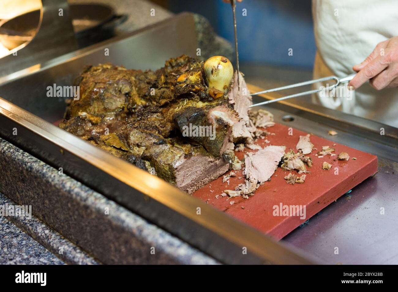 Chef carving and serving roast meat Stock Photo - Alamy