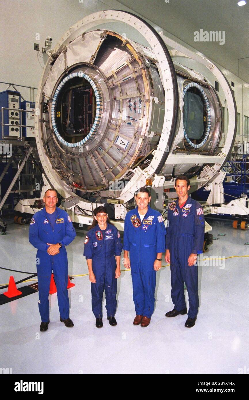 Members of the STS-88 crew pose with the Node 1 of the Internation ...