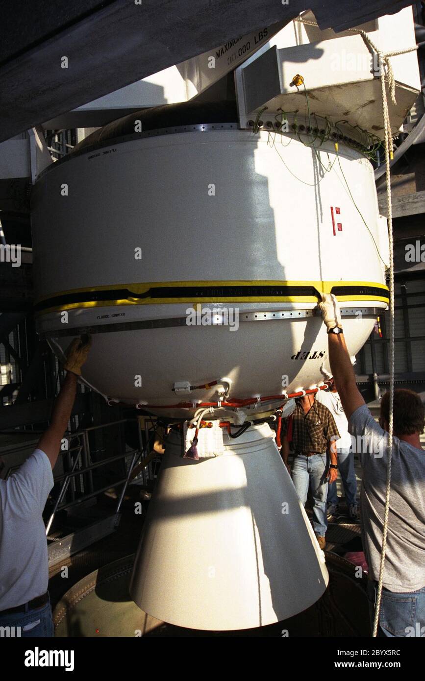 The third stage of the Lockheed Martin Athena launch vehicle is placed ...