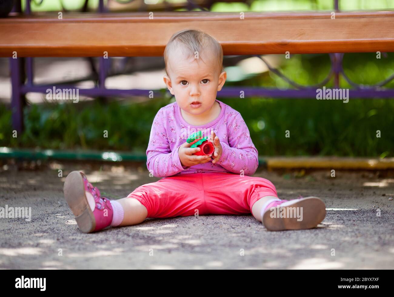 Small baby playing with toy Stock Photo - Alamy