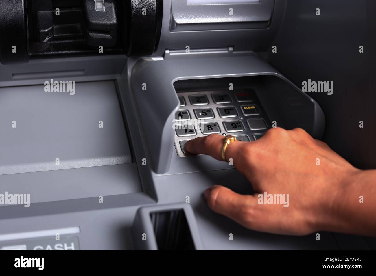 Close Up of Female Hand entering Personal Identification Number at an ...