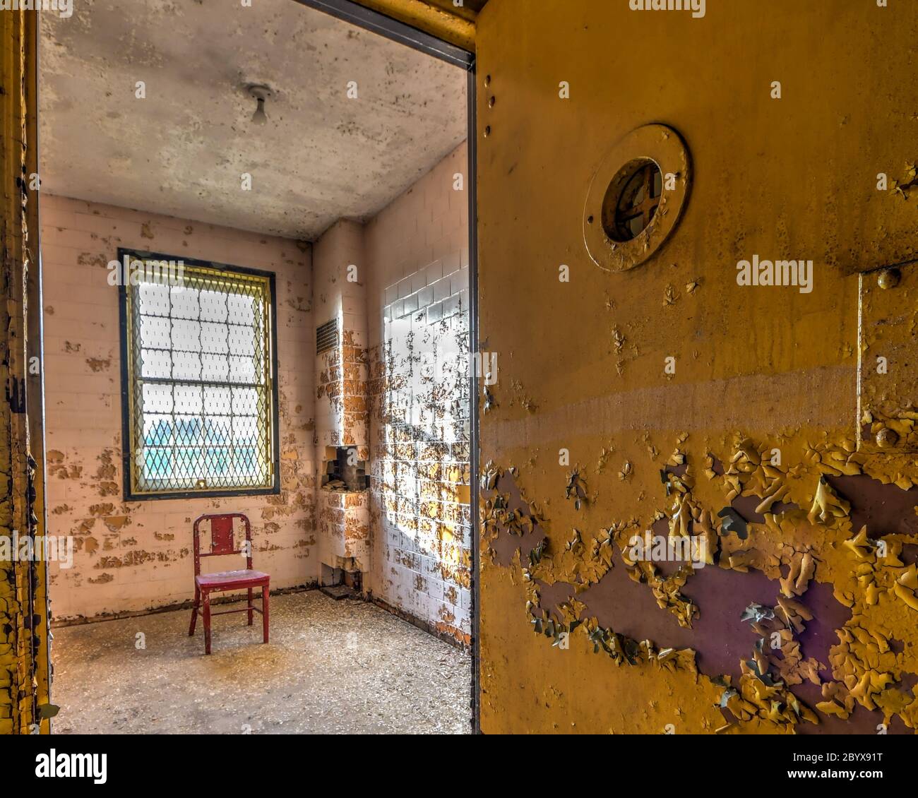 Red metal chair in the isolation ward of an abandoned hospital Stock ...