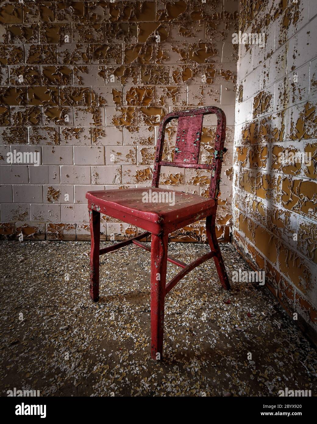 Red metal chair in the isolation ward of an abandoned hospital Stock ...