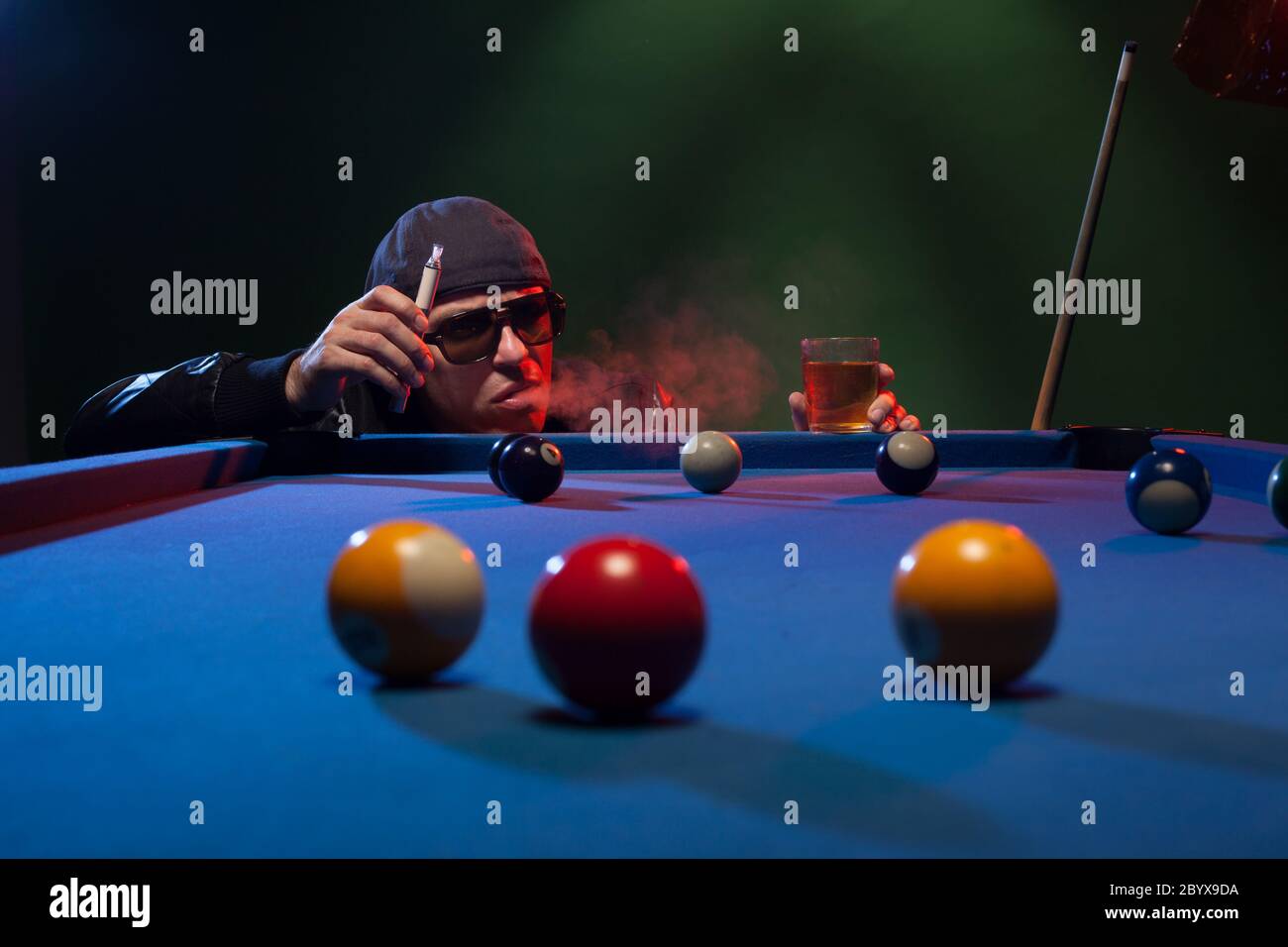 Man in sunglasses smoking cigarette hi-res stock photography and images ...