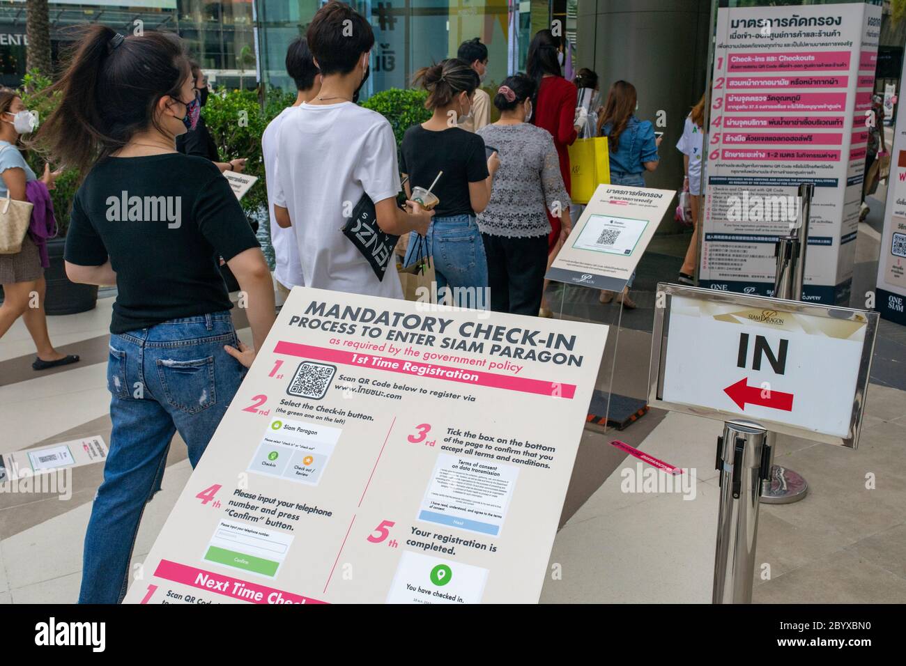 Thai citizens in queue scanning the QR Code to check-in via the ...