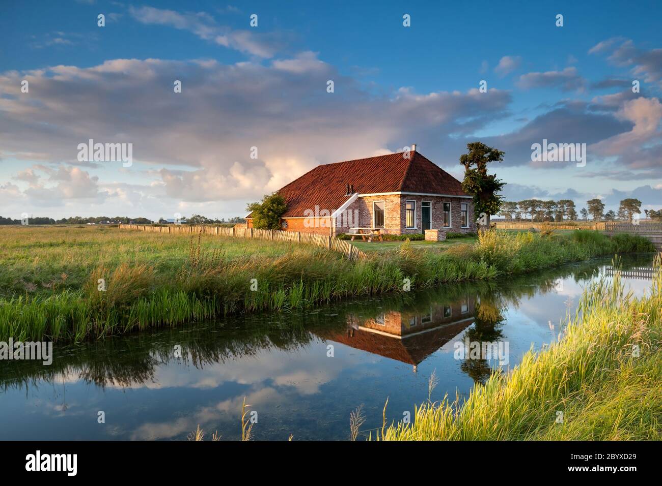 cozy farmhouse in gold sunset sunlight Stock Photo - Alamy