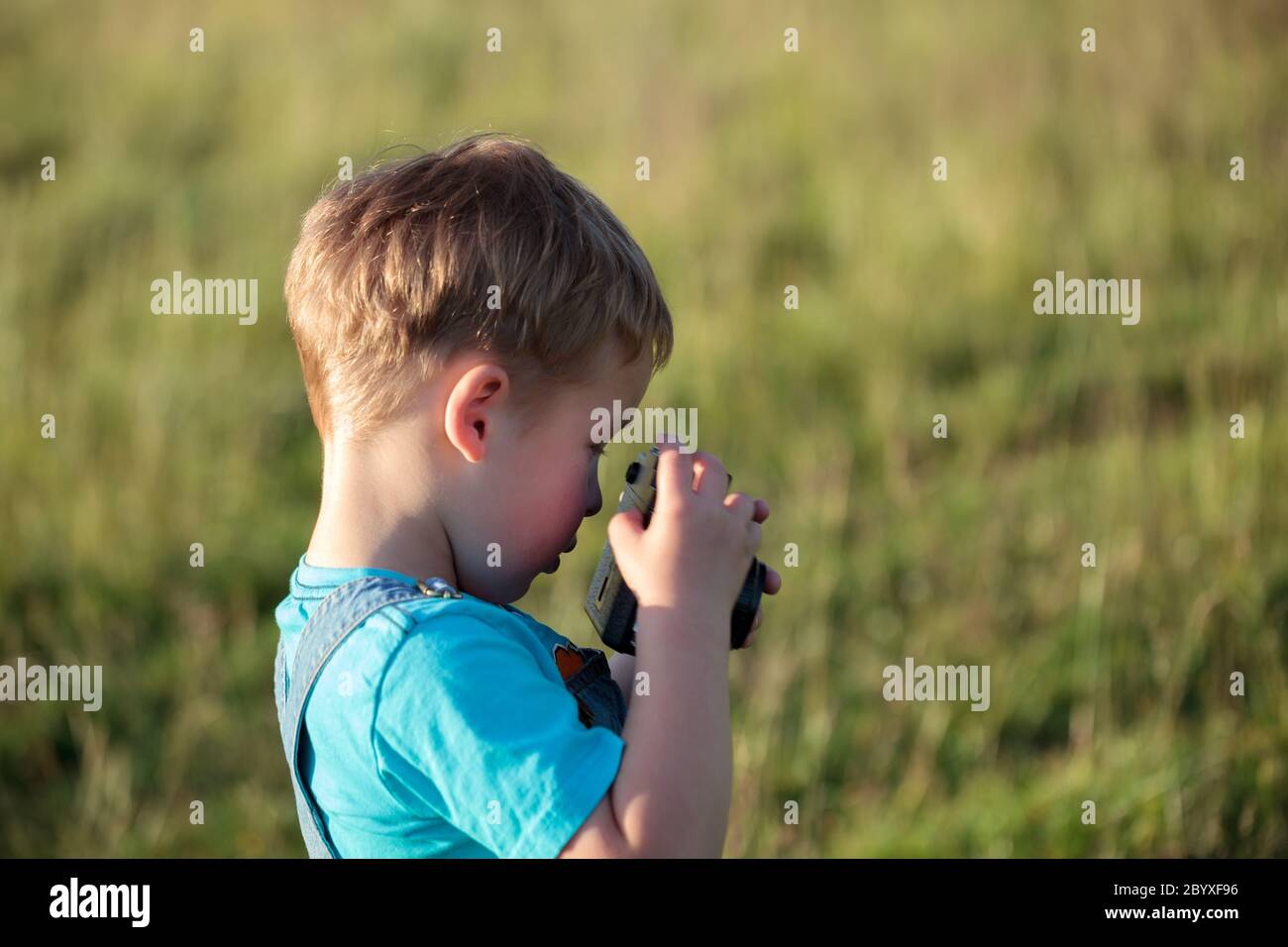 Little boy with camera outdoor Stock Photo - Alamy