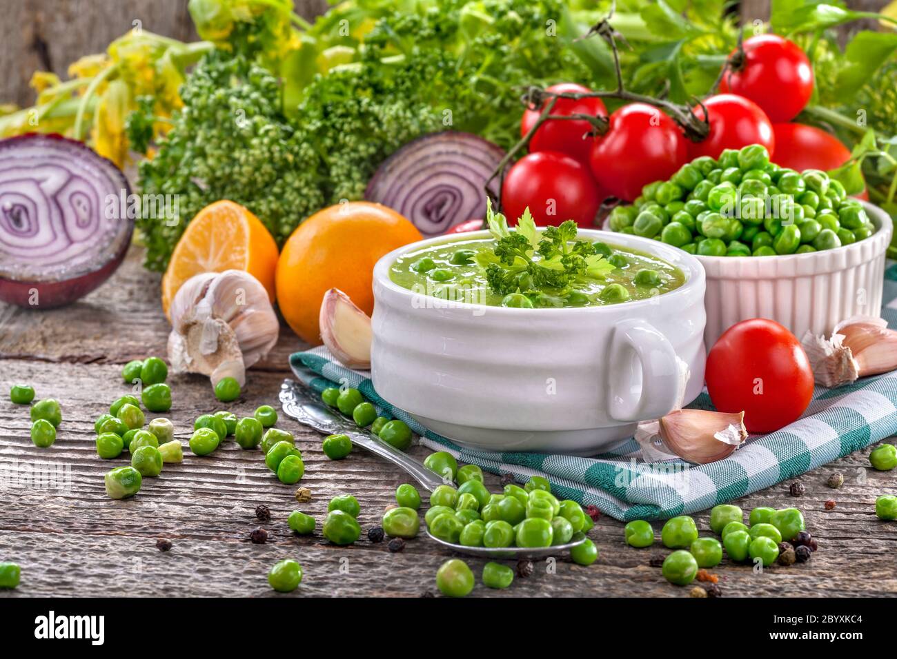 Homemade potage soup made from healthy peas with vegetable decoration ...