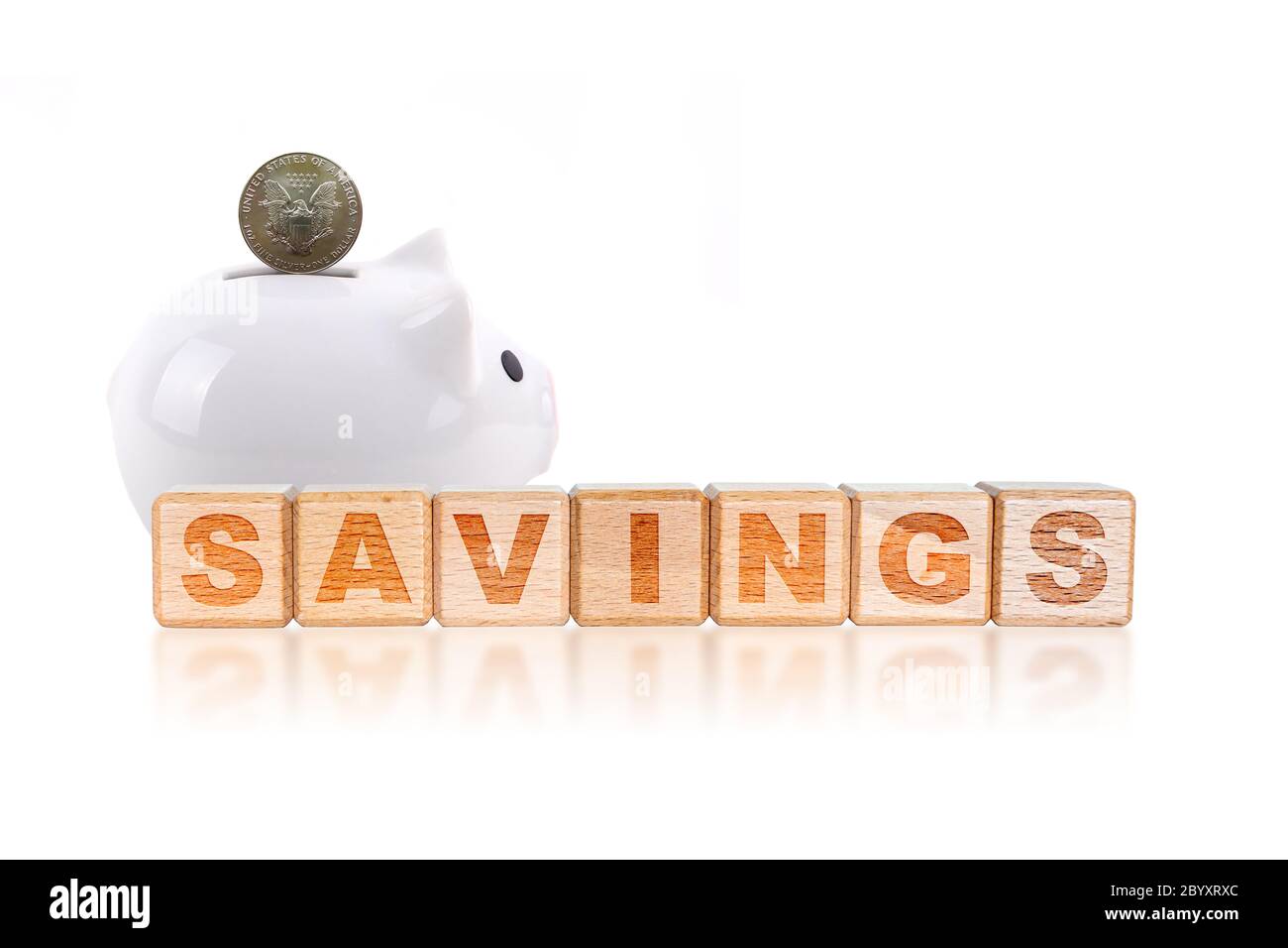 Concept of savings with word engraved on wooden alphabet cube blocks ...