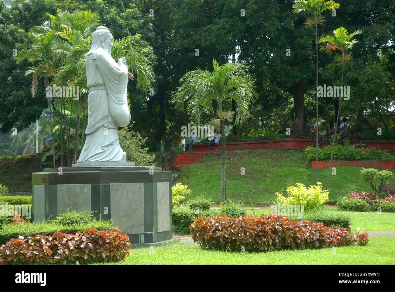 A stone statue of Confucius in the Chinese Garden, Rizal Park or Luneta ...