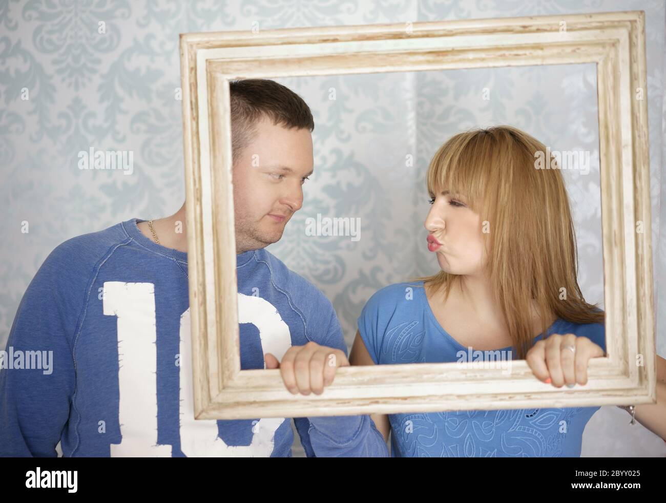 Loving couple in picture frame Stock Photo - Alamy