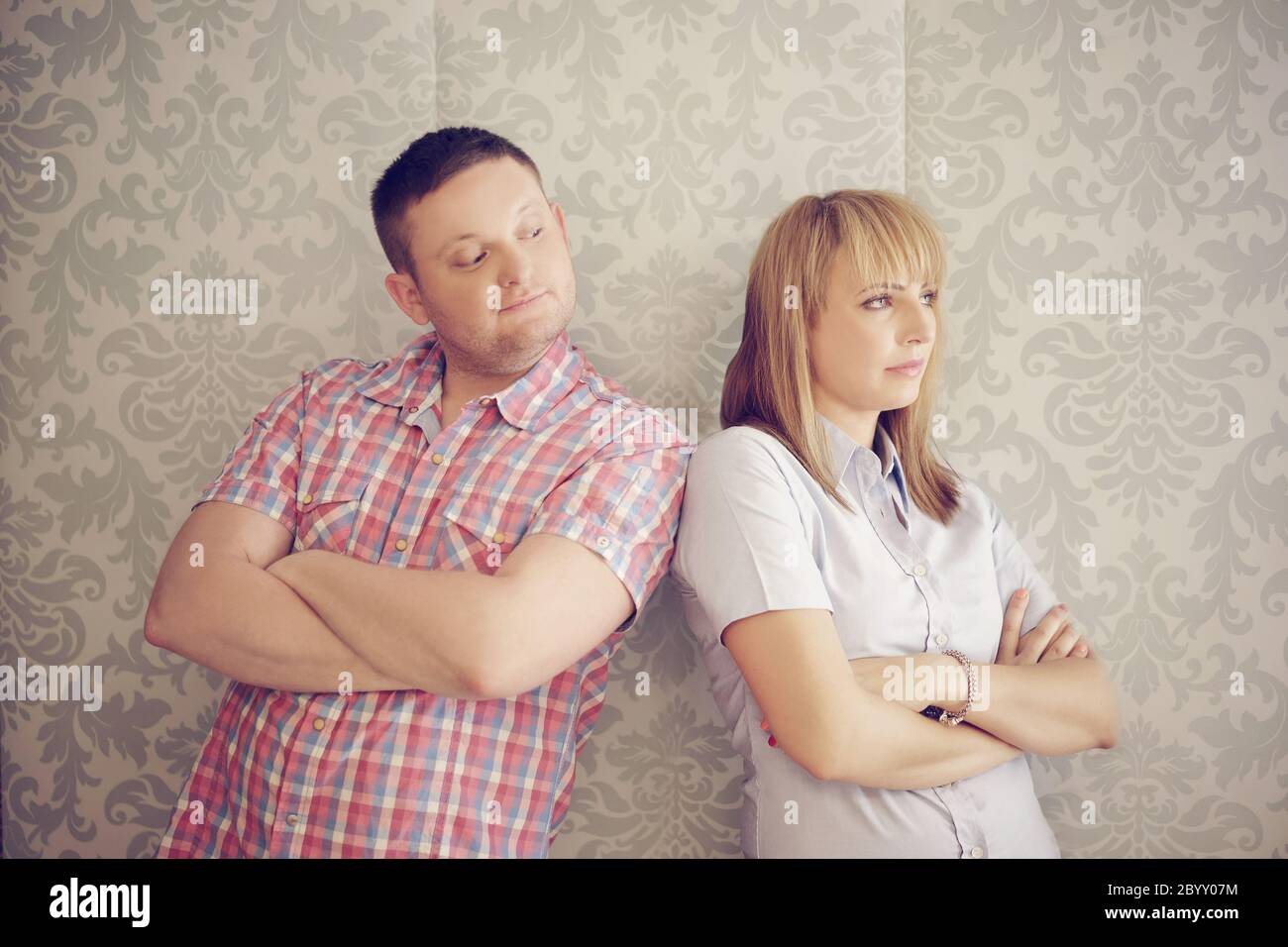 Couple ignoring each other after an argument Stock Photo - Alamy