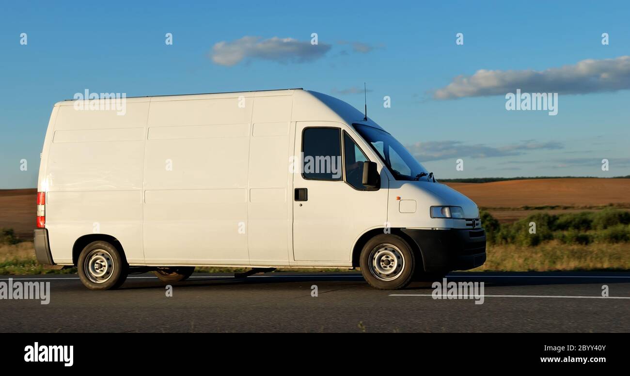 White delivery minitruck Stock Photo - Alamy