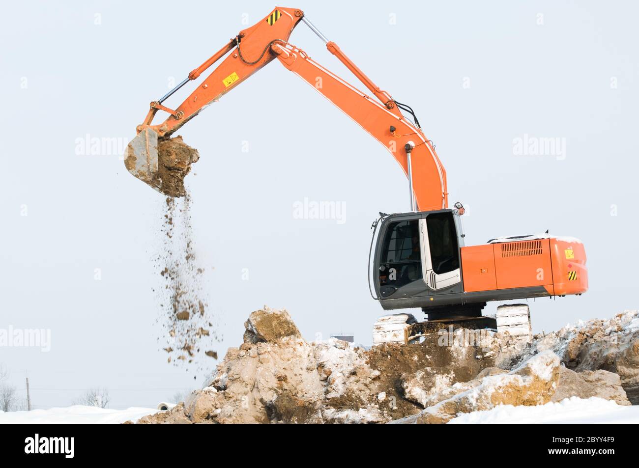 excavator loader at winter works Stock Photo - Alamy