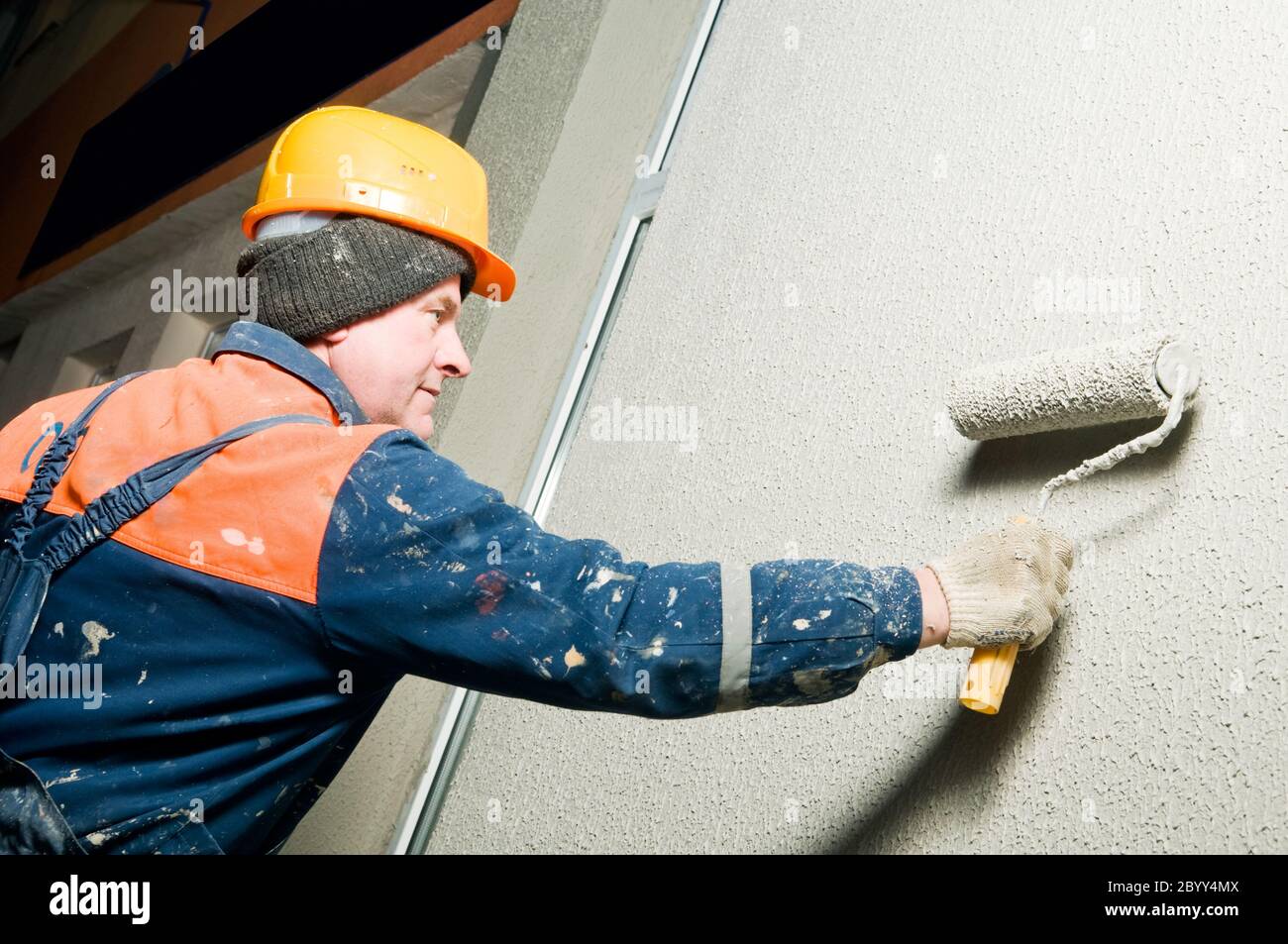 builder plastering facade wall Stock Photo - Alamy