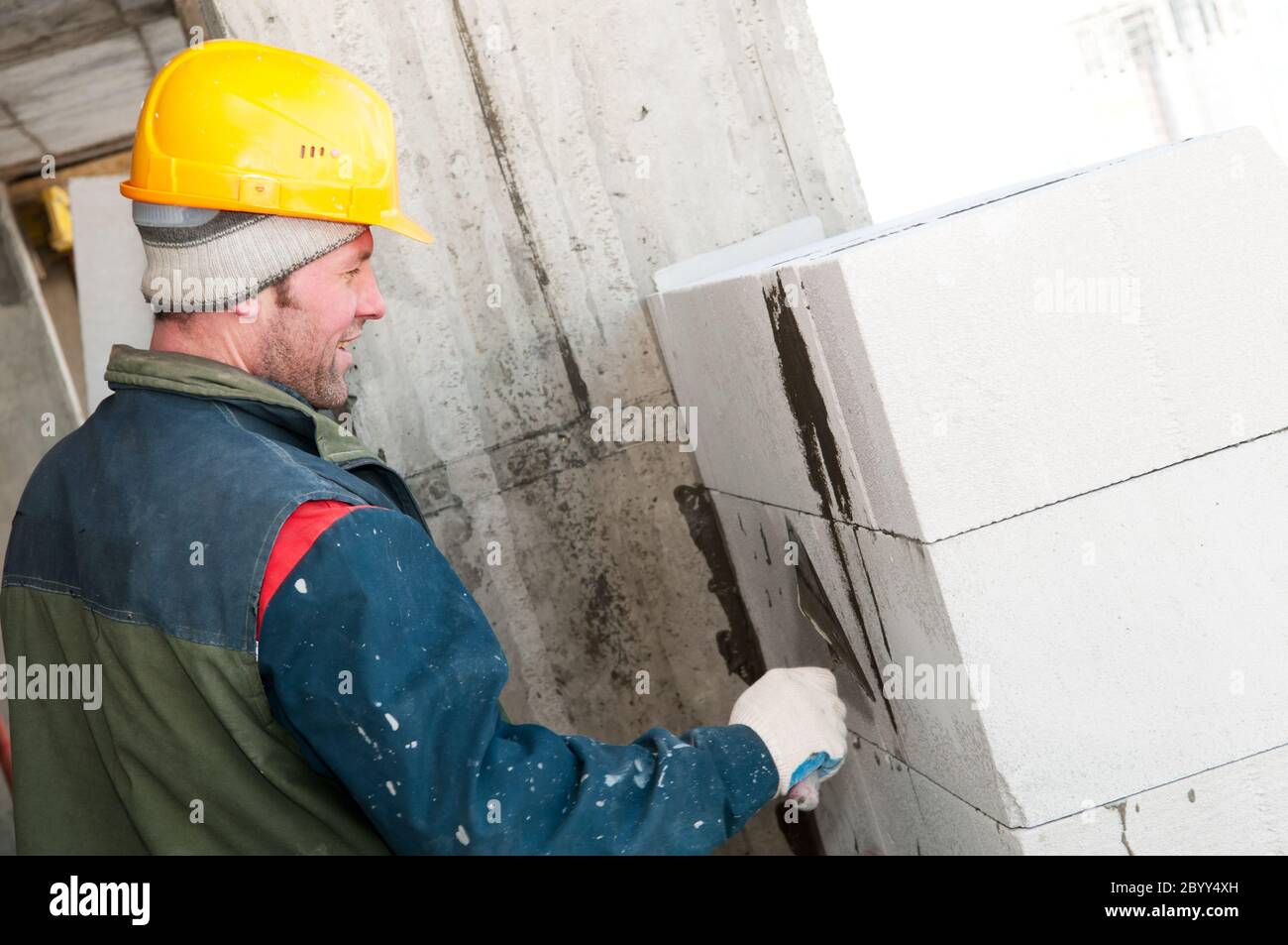 builder mason at bricklaying work Stock Photo - Alamy