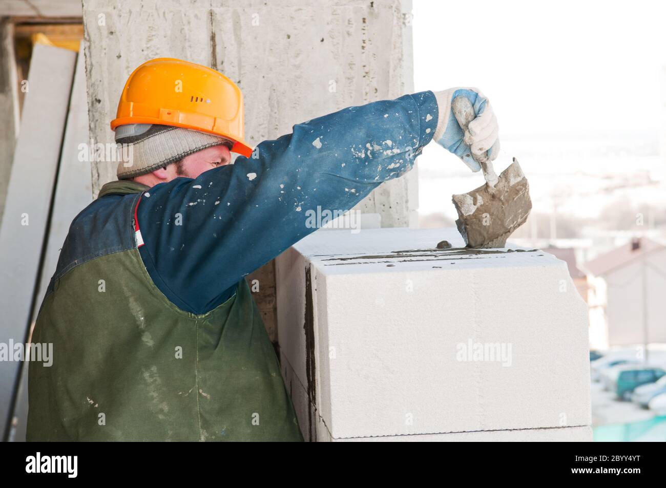 worker mason at bricklaying work Stock Photo - Alamy