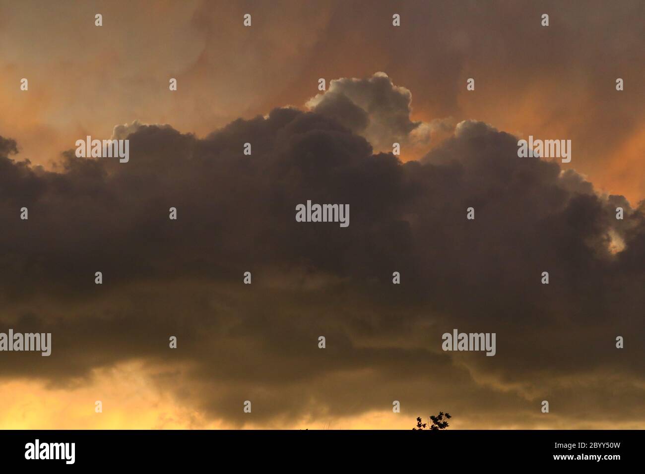 Dark amber storm clouds, full frame Stock Photo - Alamy