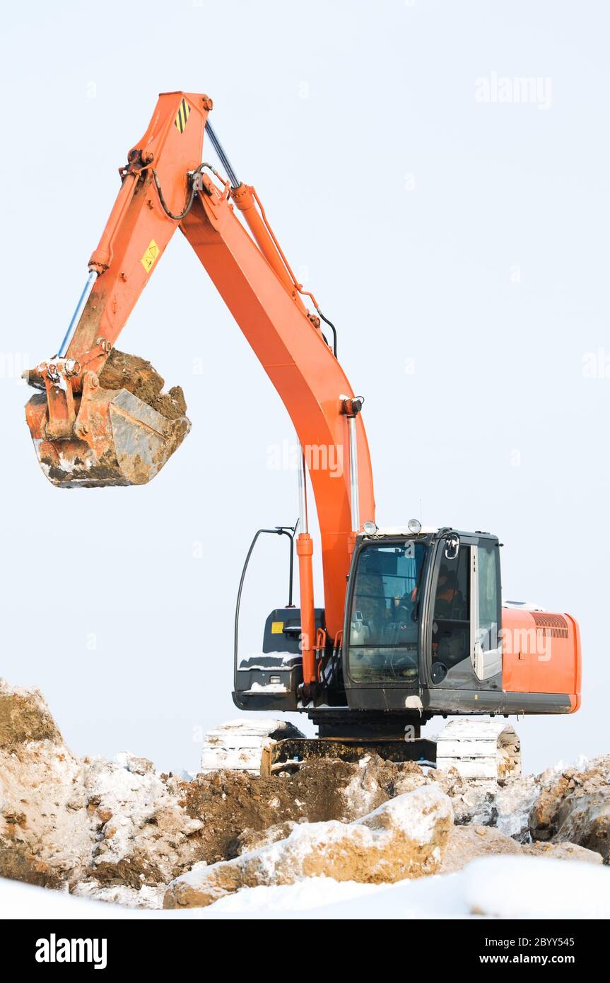 excavator loader at winter works Stock Photo - Alamy