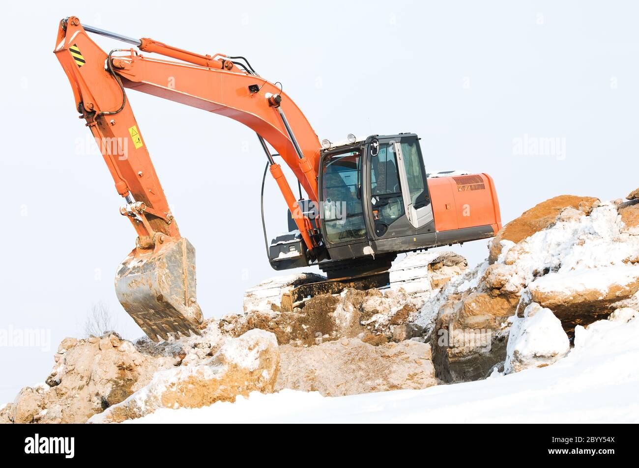 excavator loader at winter works Stock Photo - Alamy