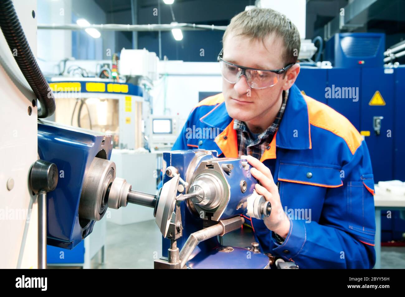 worker at machine tool operating Stock Photo - Alamy