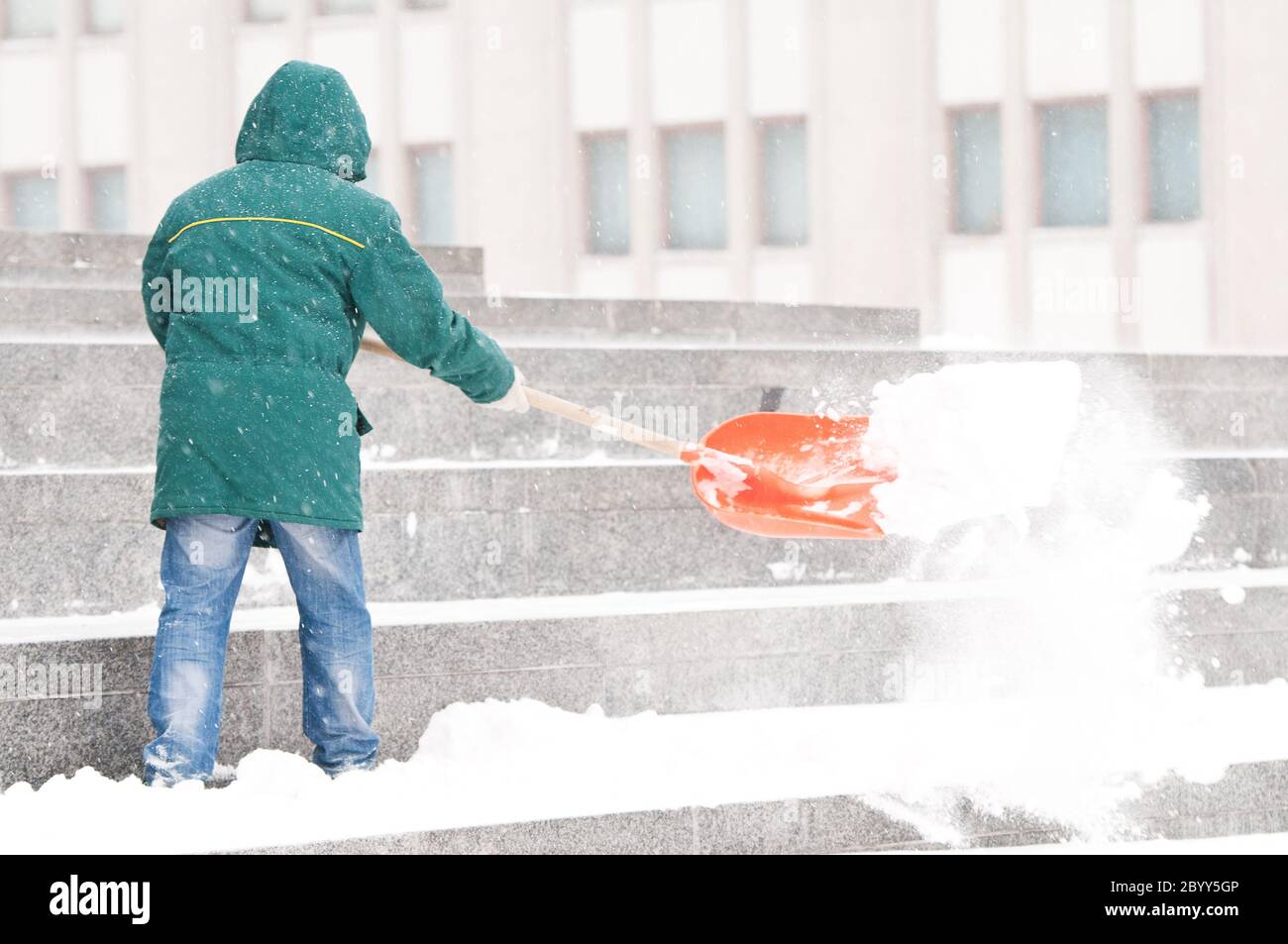 Man shoveling hi-res stock photography and images - Alamy