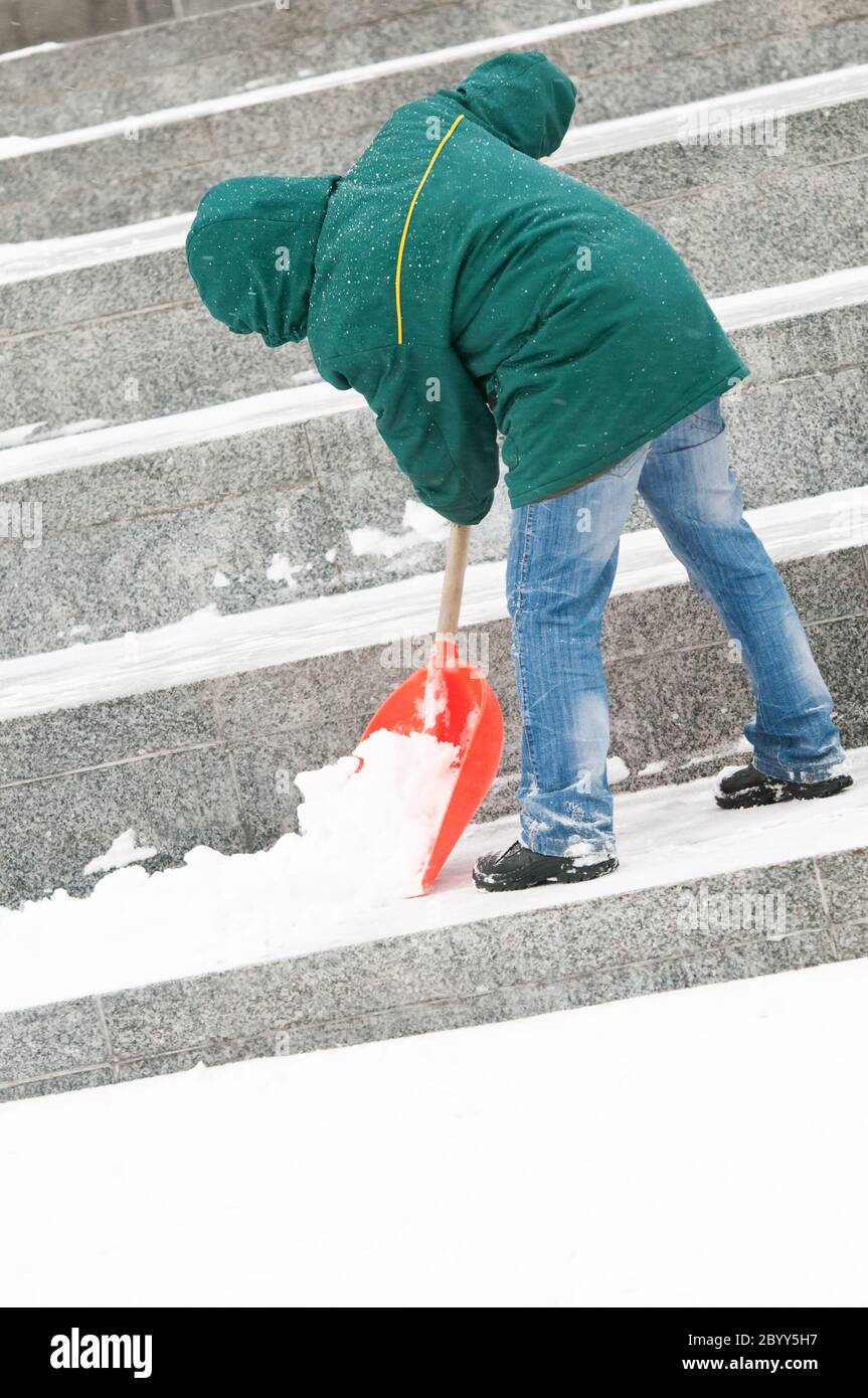 Man shoveling winter snow Stock Photo - Alamy