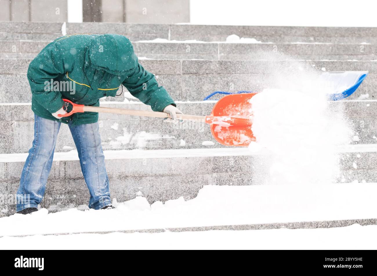 Man shoveling winter snow Stock Photo - Alamy