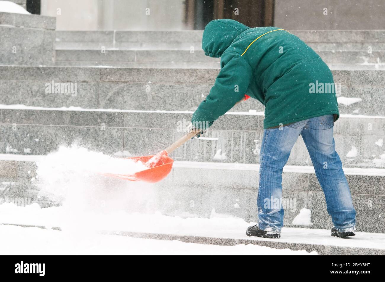 Man shoveling snow Stock Photo - Alamy