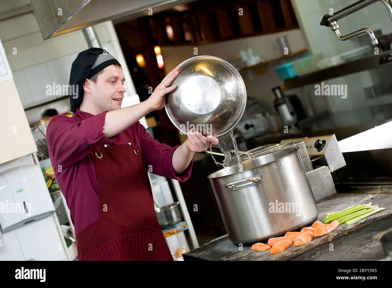 chef at work in kitchen Stock Photo - Alamy