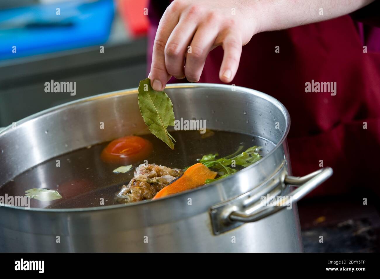 cooking a soup in pot Stock Photo - Alamy