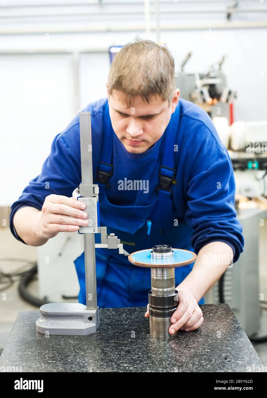 worker measuring cutting tool Stock Photo - Alamy