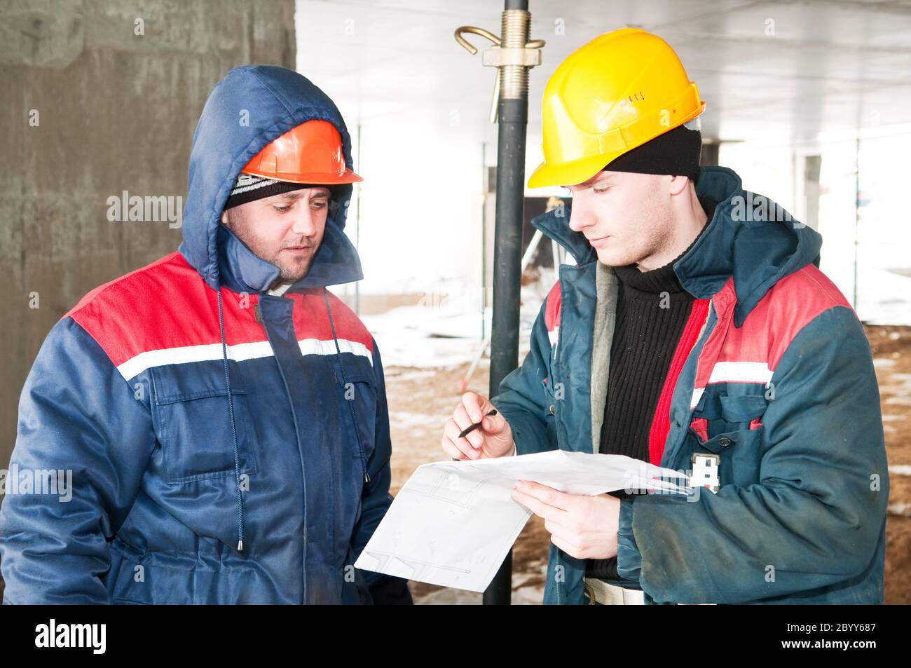 Engineers builders at construction site Stock Photo - Alamy