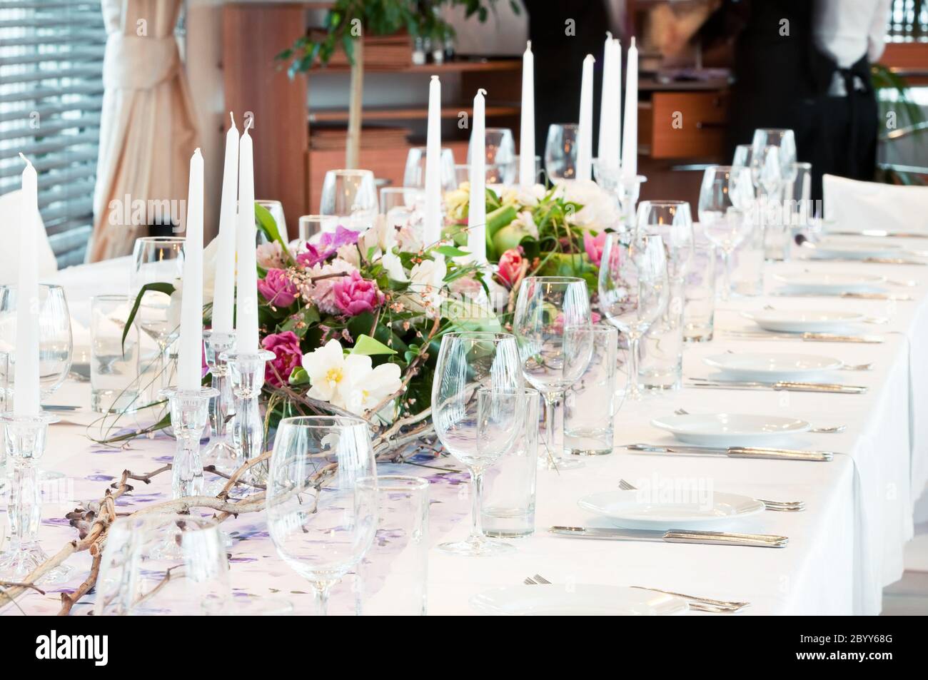 catering table set with flowers Stock Photo - Alamy