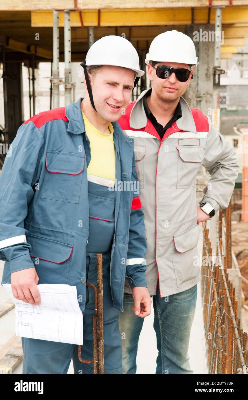 Engineers builders at construction site Stock Photo - Alamy