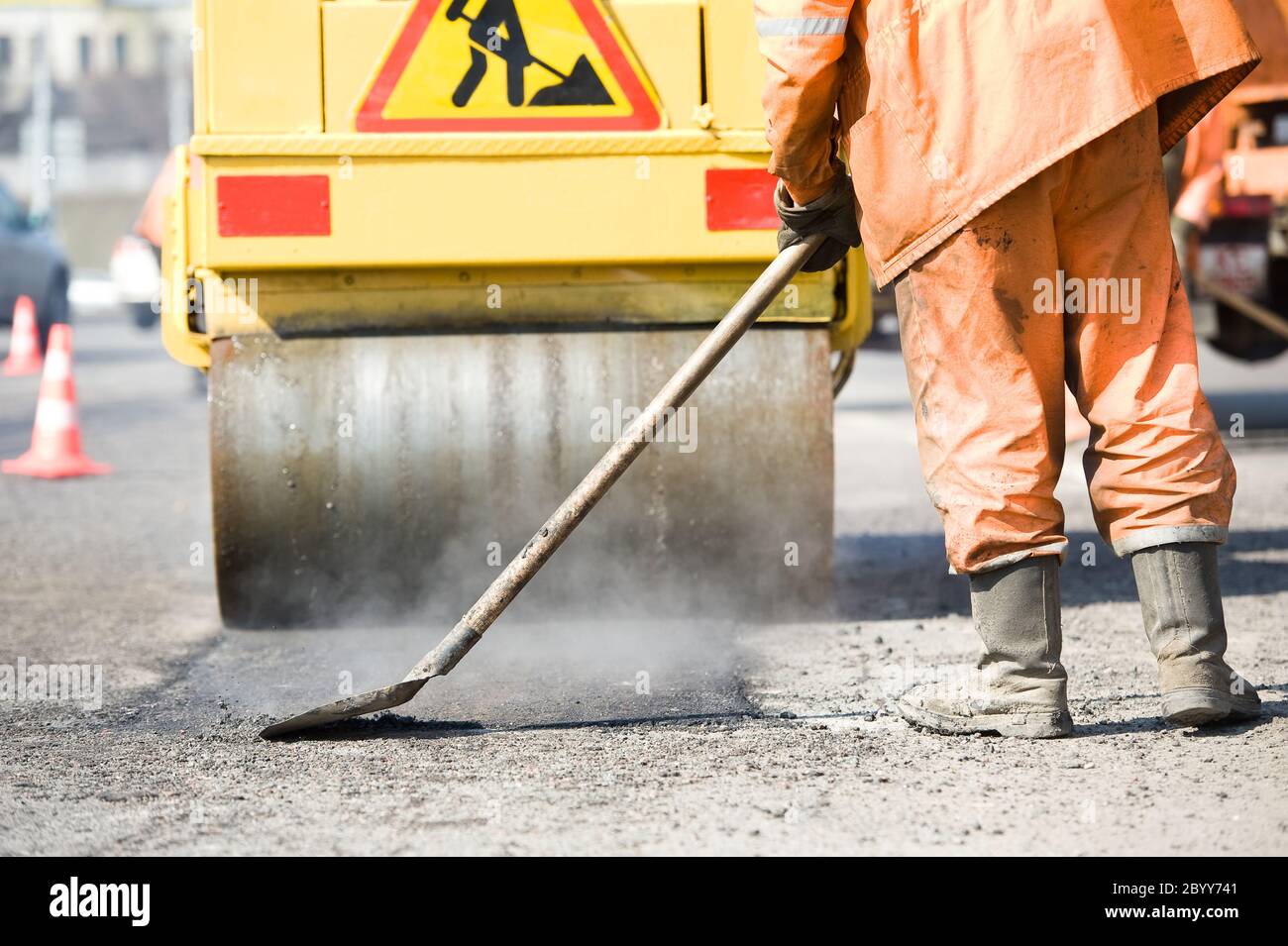 Asphalt paving works with compactor Stock Photo - Alamy