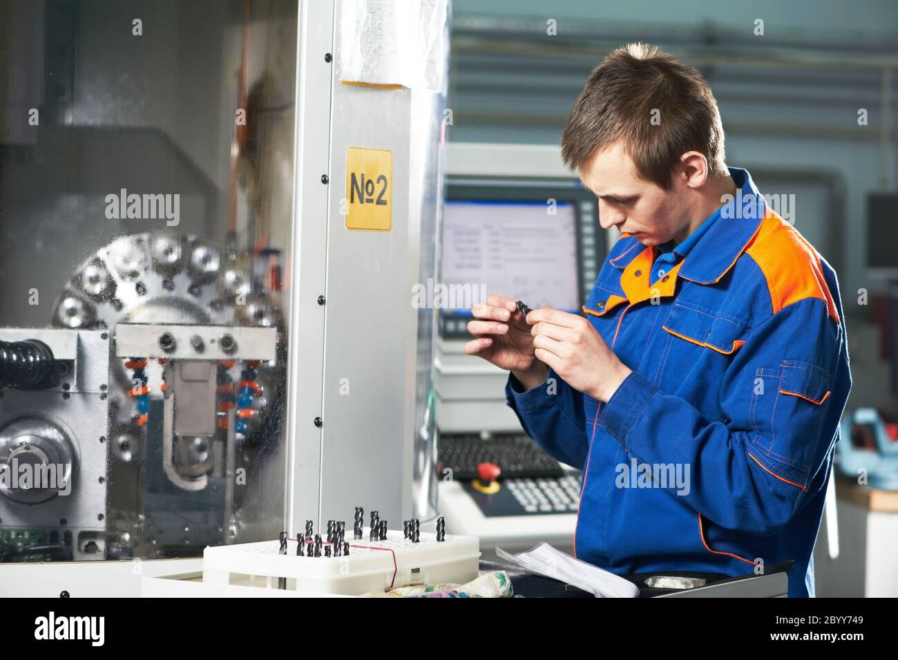 worker measuring detail Stock Photo - Alamy