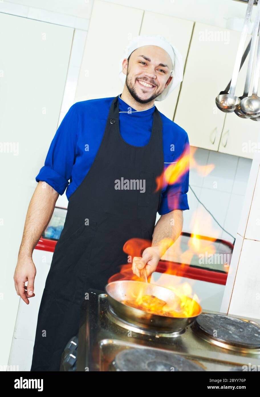 chef making flambe meat Stock Photo - Alamy