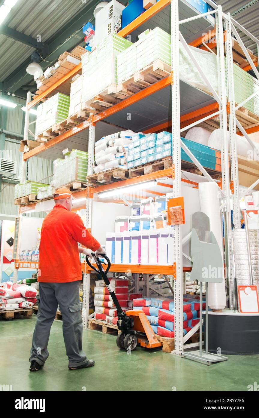 worker distribution in warehouse with forklift Stock Photo - Alamy