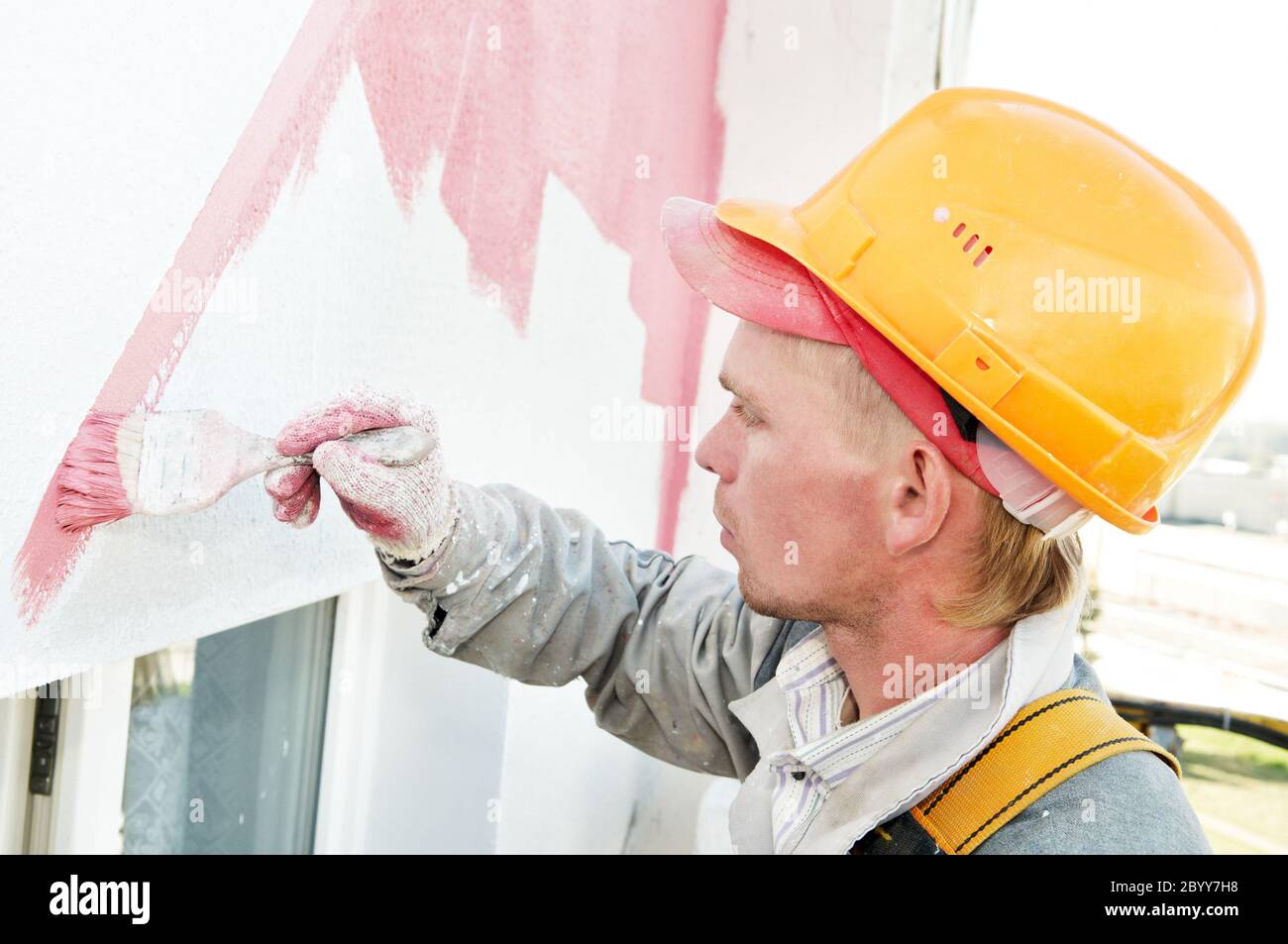 builder facade painter at work Stock Photo - Alamy