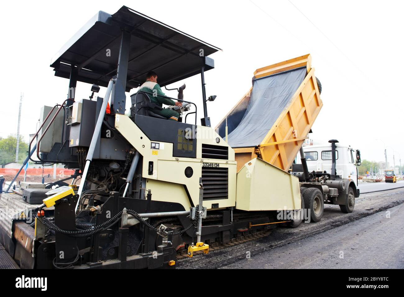 Dump truck asphalt paver road hi-res stock photography and images - Alamy