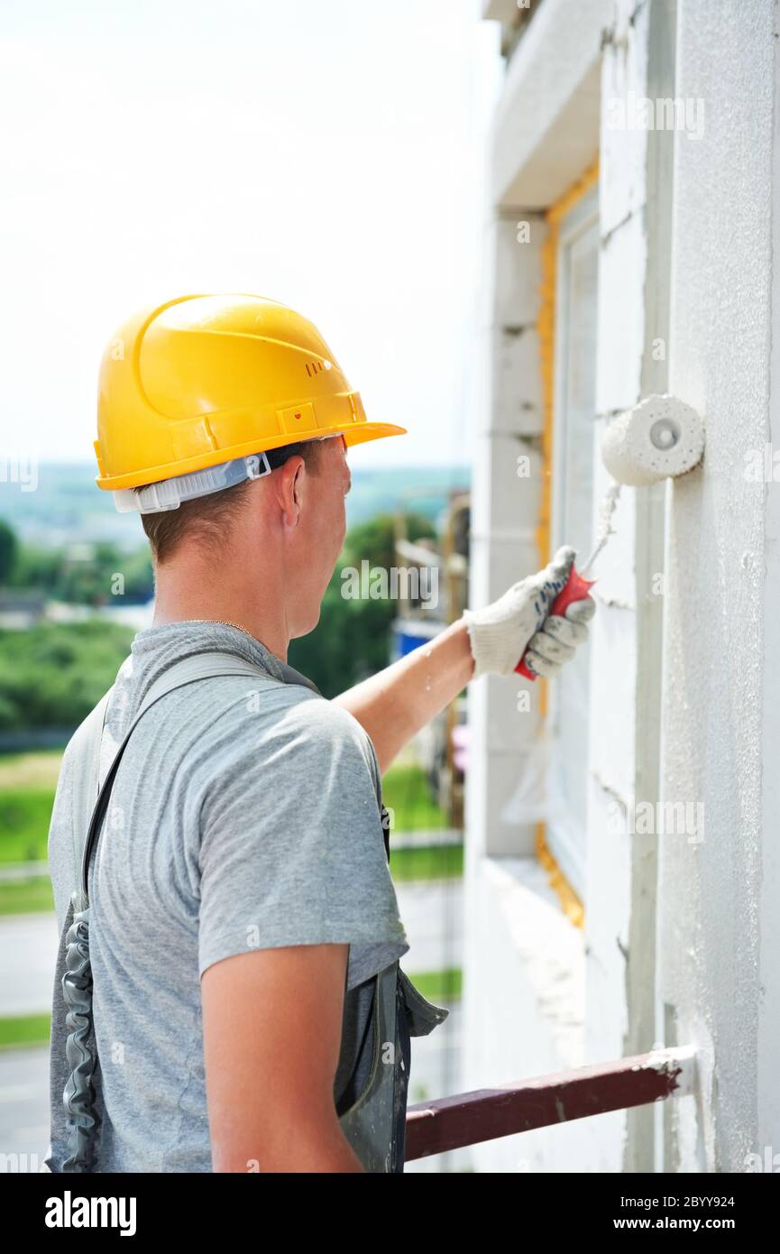 builder facade painter worker Stock Photo - Alamy
