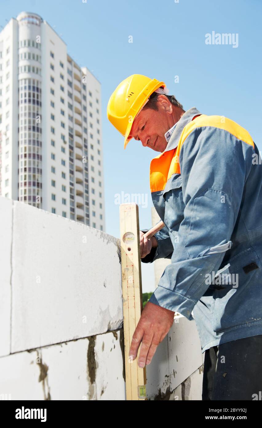 bricklayer at construction masonry works Stock Photo - Alamy