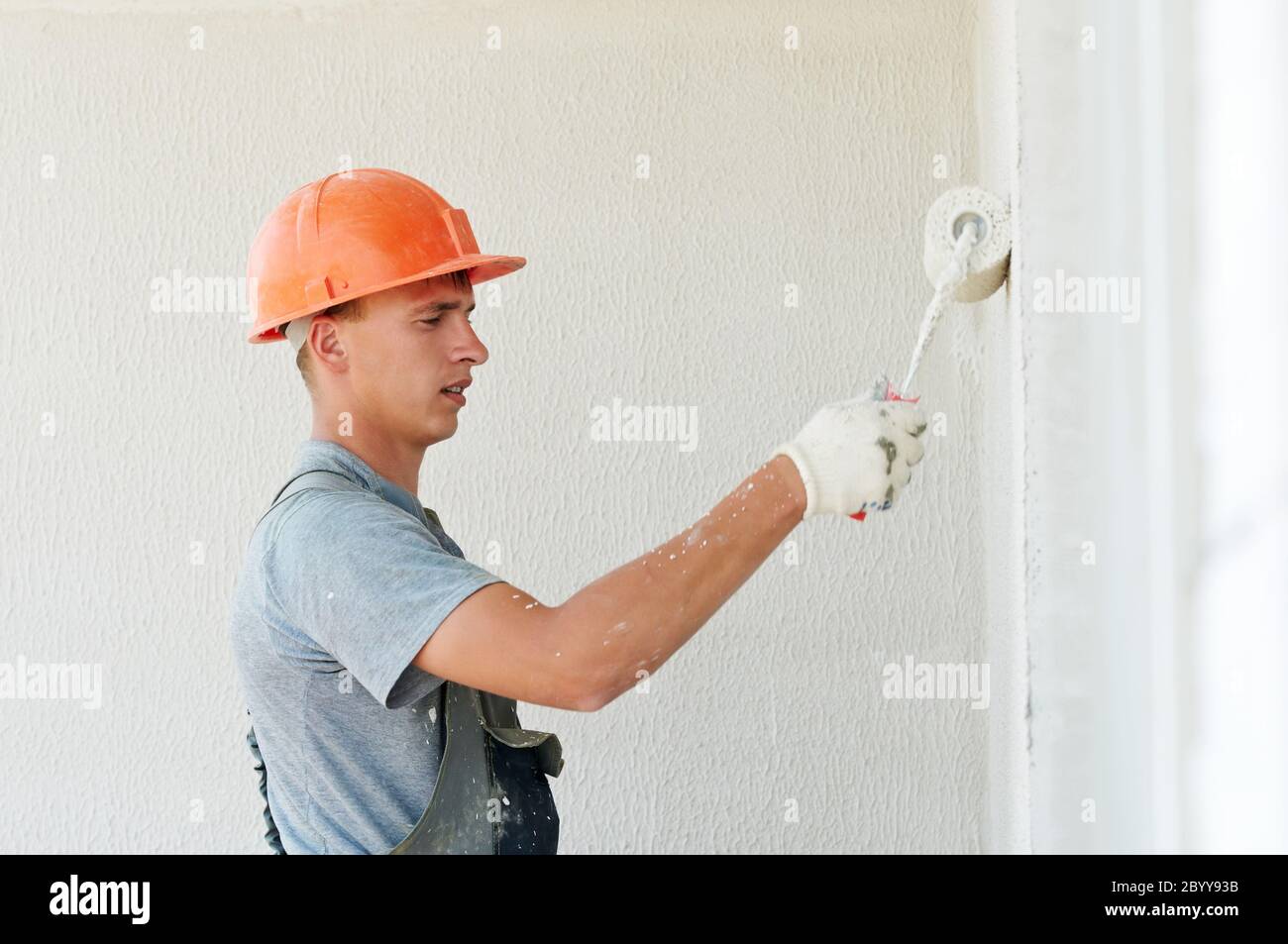 builder facade plasterer worker Stock Photo - Alamy