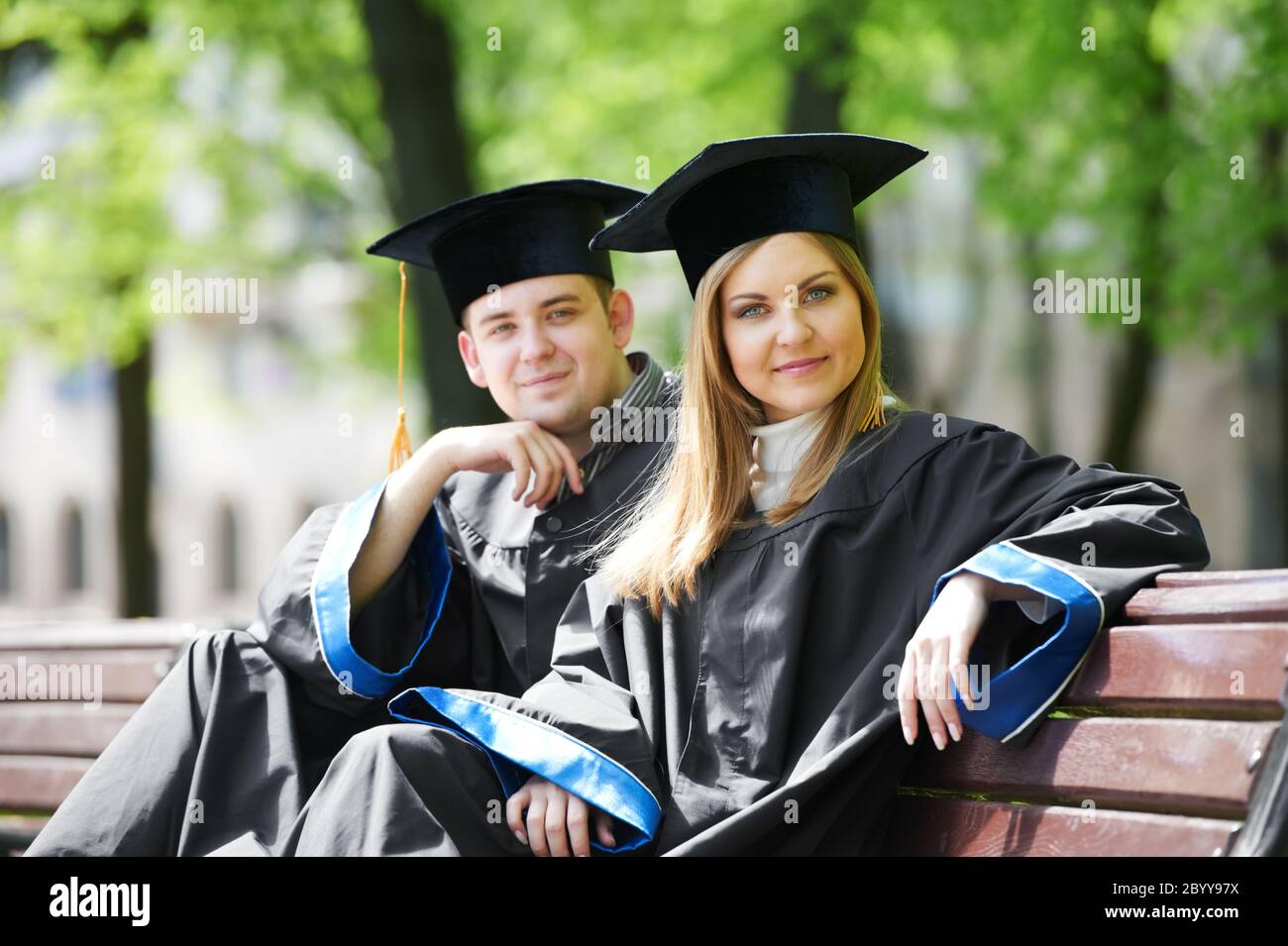 happy graduate students outdoors Stock Photo - Alamy