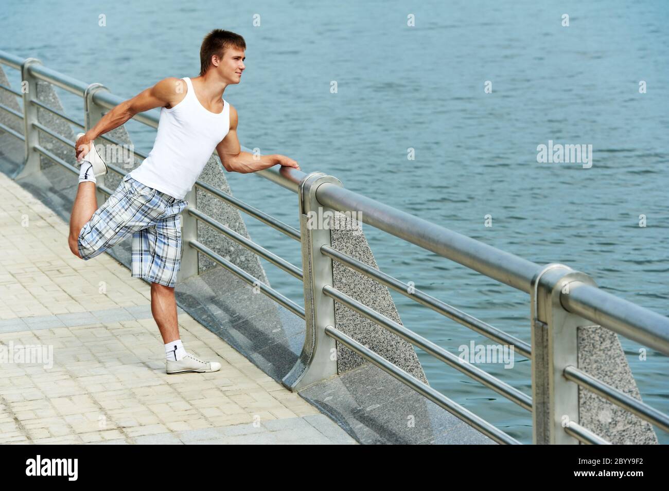 Stretching exercises before sport jogging Stock Photo - Alamy