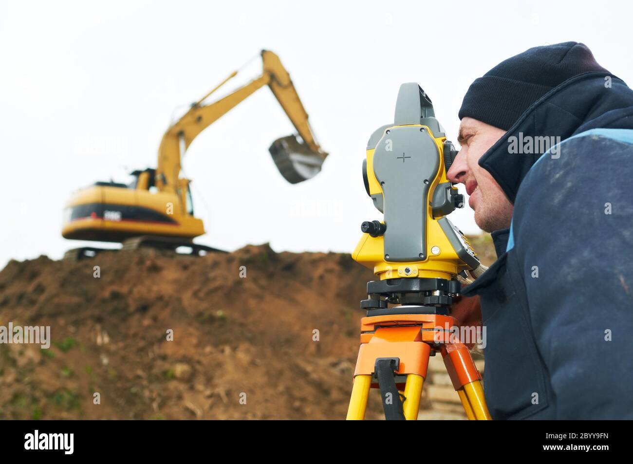 surveyor works with theodolite tacheometer Stock Photo - Alamy
