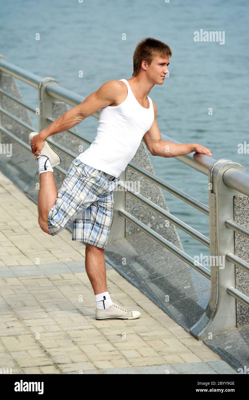 Stretching exercises before sport jogging Stock Photo - Alamy