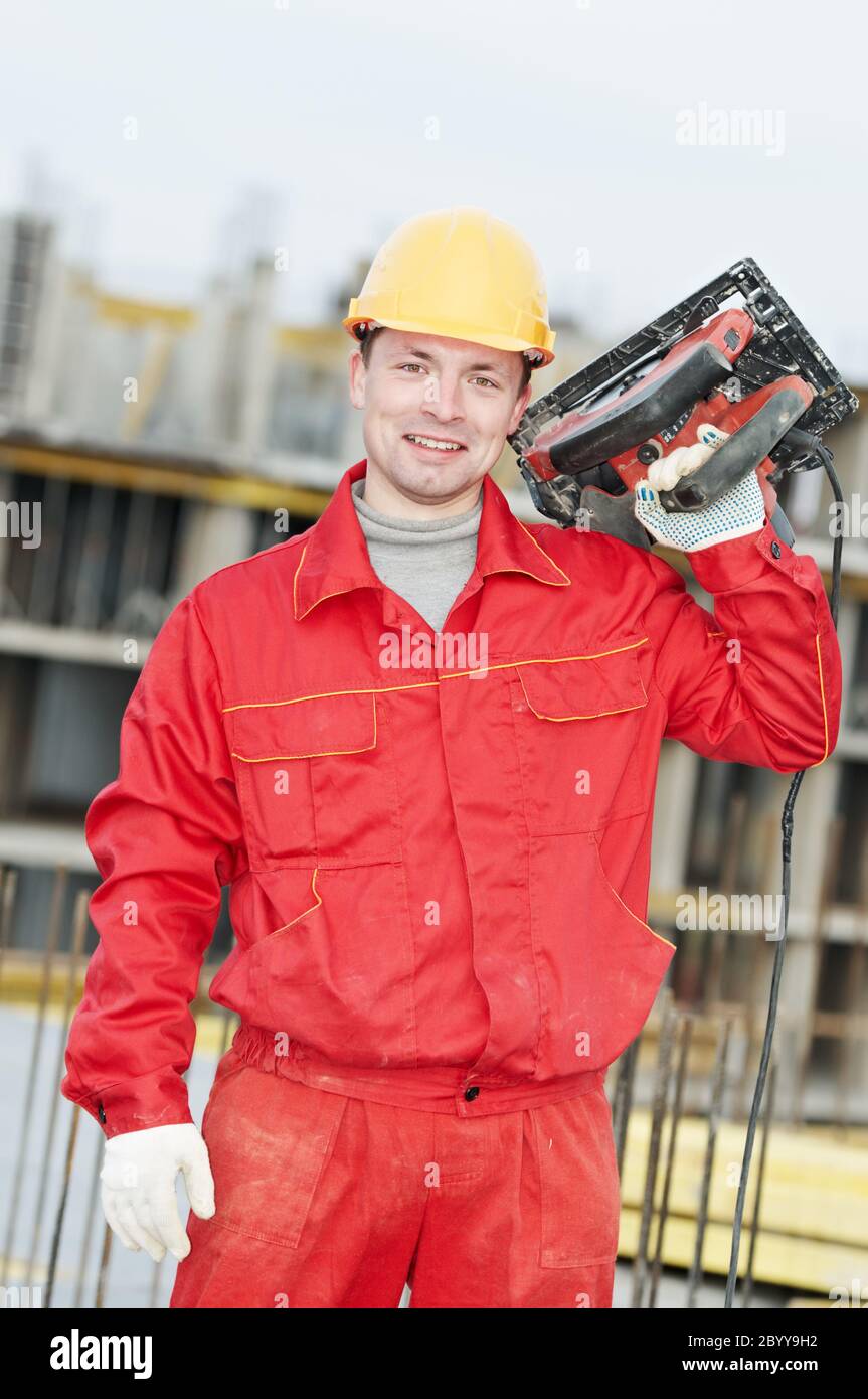 portrait of construction worker with saw Stock Photo - Alamy