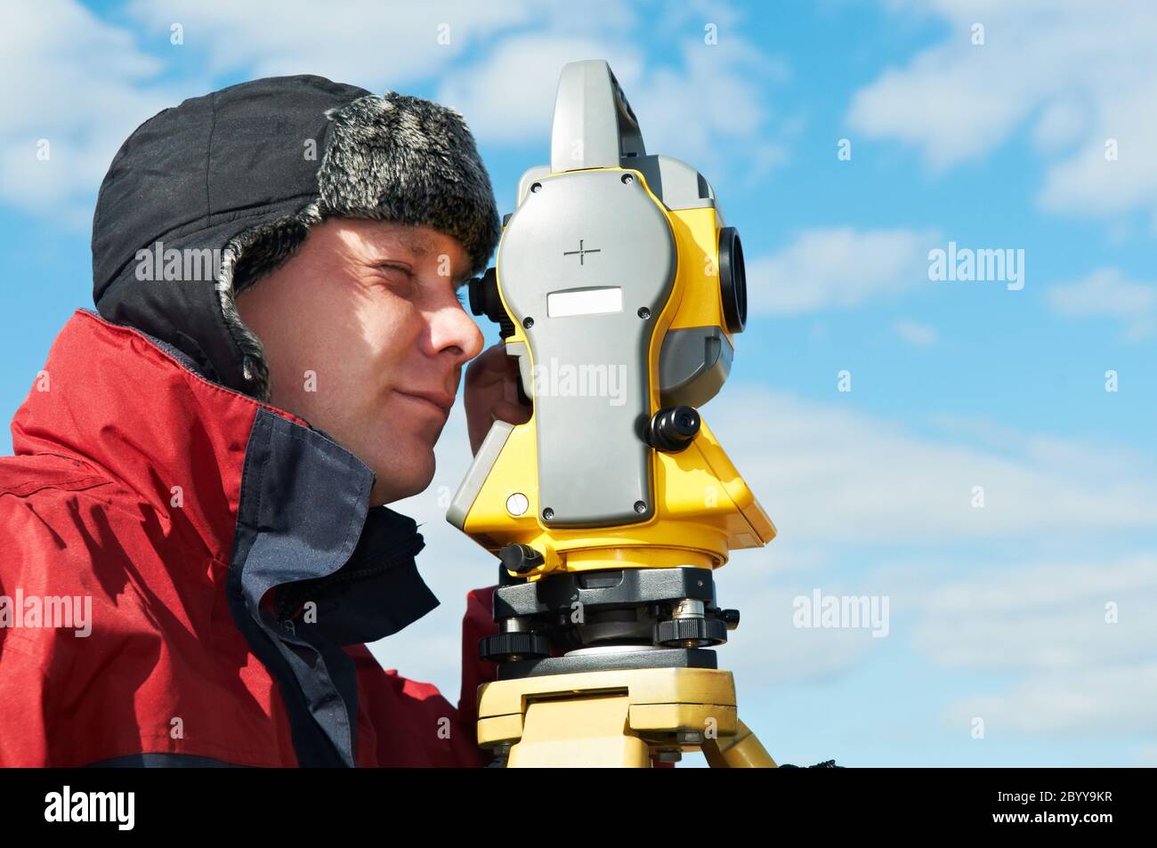 surveyor works with theodolite tacheometer Stock Photo - Alamy